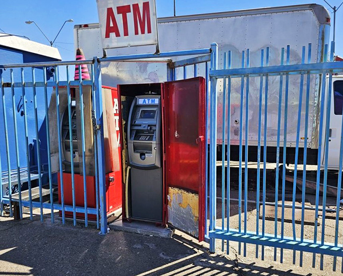 The swap meet ATM: where hope, cash, and impulse purchases converge behind bars that somehow make it look both sketchy and legitimate.