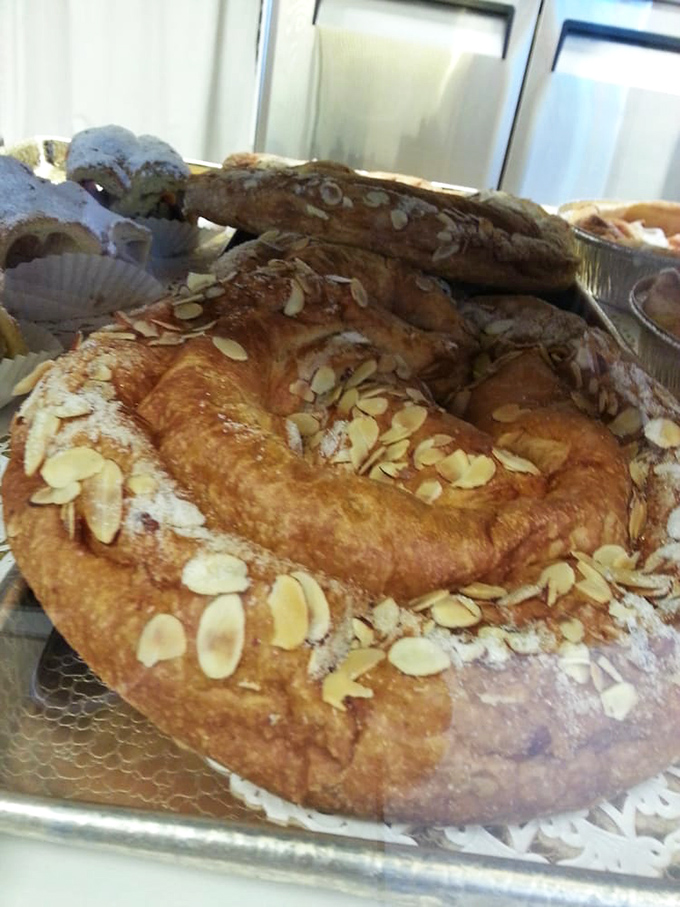 The almond kringle's golden exterior hides a treasure of almond paste within. It's the pastry equivalent of striking gold in the California hills.
