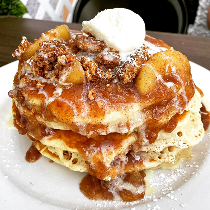 These apple pancakes aren't just breakfast, they're an architectural achievement—layers of fluffy goodness supporting caramelized apples in a gravity-defying stack of morning bliss.