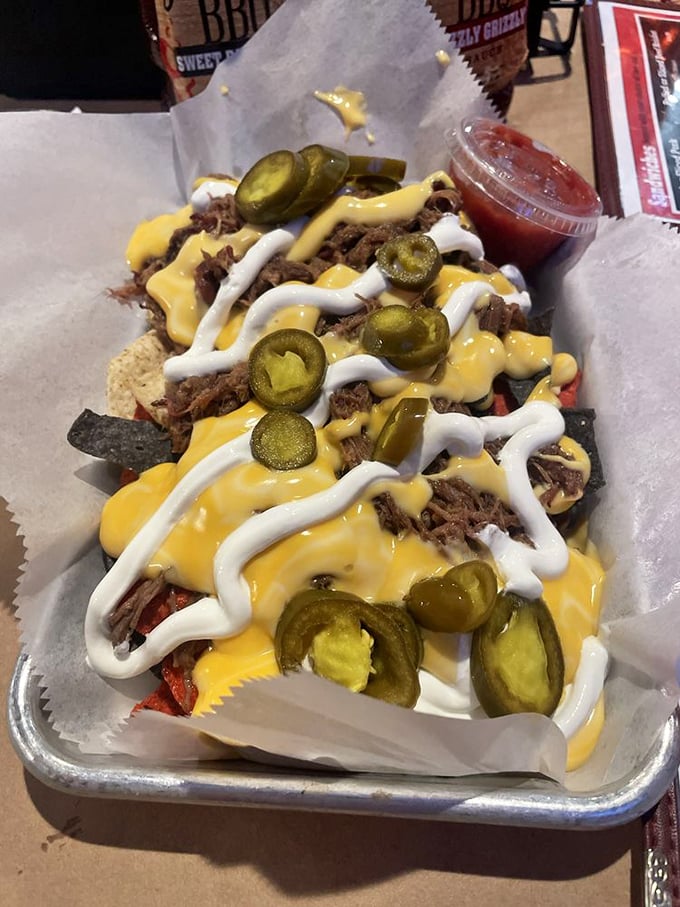 BBQ nachos that break all the rules in the best possible way—pulled meat, two sauces, jalapeños, and enough cheese to make Wisconsin proud.