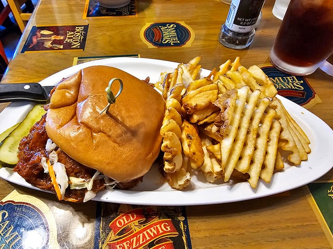 This isn't just a sandwich; it's an architectural marvel of BBQ pork that requires both hands and several napkins.