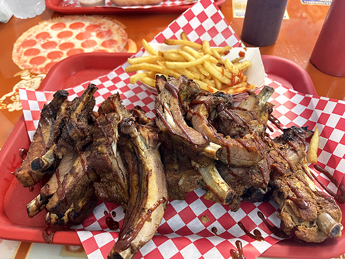 Rib revelation! These smoke-kissed beauties with their glistening bark are what barbecue dreams are made of—no white tablecloth required.