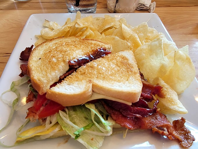 This isn't just a sandwich—it's architecture. Layers of bacon, fresh veggies, and toasted bread create the skyscraper of lunch options.