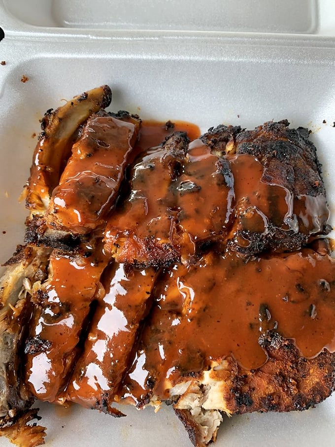 The sauce-to-char ratio here is mathematical perfection. These baby backs aren't just falling off the bone—they're practically jumping into your mouth.