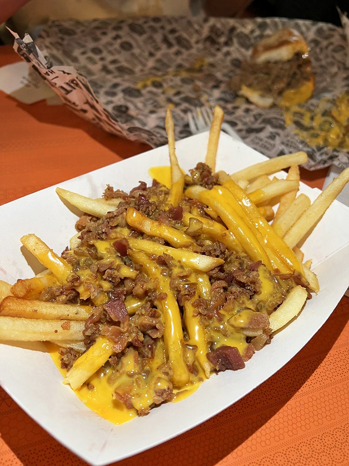 These cheese fries aren't just a side dish – they're a main event. Crispy potatoes baptized in cheese with bits of meat that'll make you forget your name.