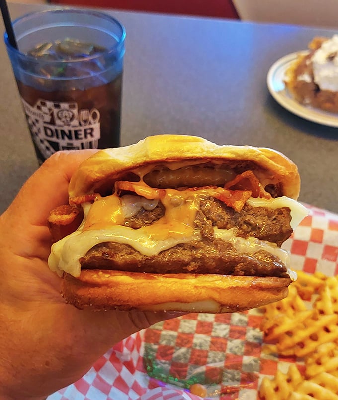 This isn't just a burger—it's edible architecture. Melted cheese cascading down perfectly seasoned beef, all nestled in a bun that knows its supporting role.