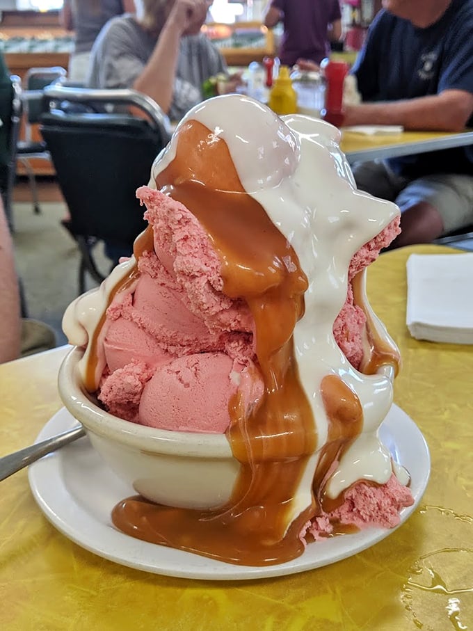 The strawberry sundae doesn't just have caramel sauce—it's wearing it like a designer outfit. Marshmallow cream adds the perfect accessory.