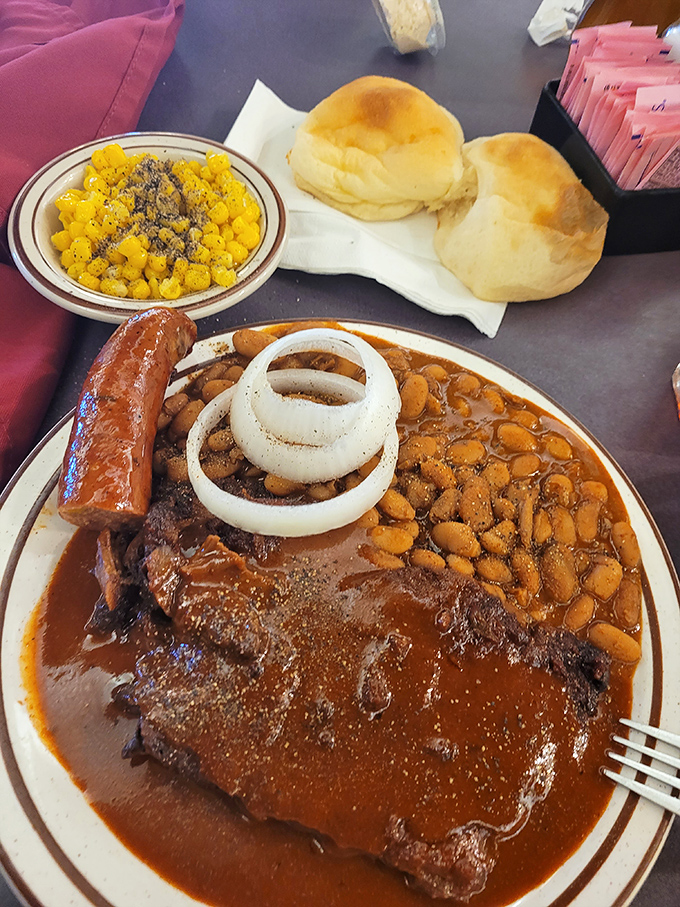 Barbecue that doesn't just sit on the plate – it performs. Those beans cuddling up to that sauce-draped beef know they're in good company.
