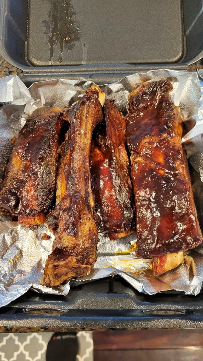 Beef ribs glistening with a lacquer of sauce and smoke. Prehistoric-looking and requiring no utensils—just commitment.