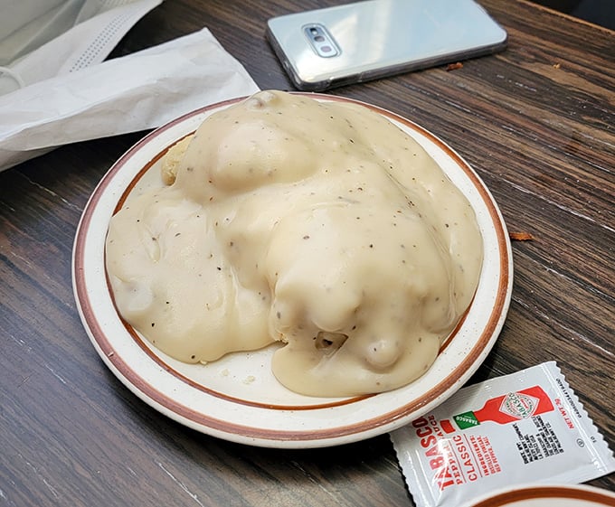 Biscuits and gravy so authentic they should come with their own Southern drawl. This plate doesn't whisper comfort food—it belts it out like Patsy Cline.