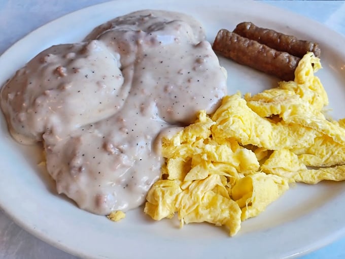 Biscuits and gravy with scrambled eggs and sausage links – the breakfast that says, "Go back to bed afterward. You've earned it."