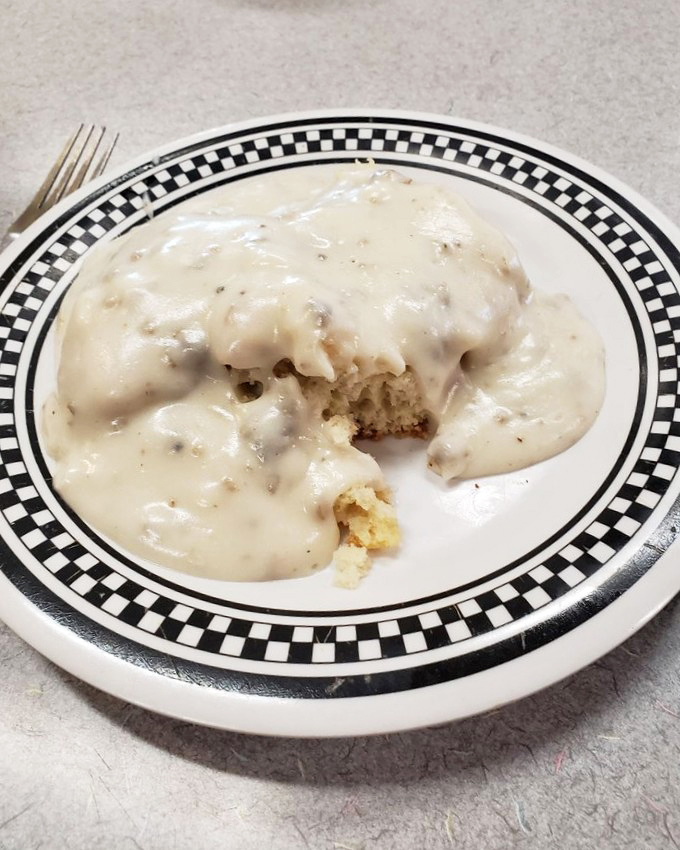 Biscuits and gravy: the breakfast that hugs you from the inside. This creamy, peppery blanket of comfort is what Midwestern dreams are made of.