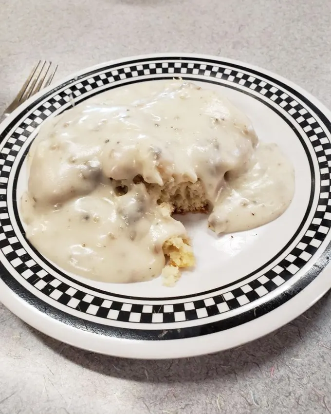 Biscuits and gravy: the breakfast that hugs you from the inside. This creamy, peppery blanket of comfort is what Midwestern dreams are made of.