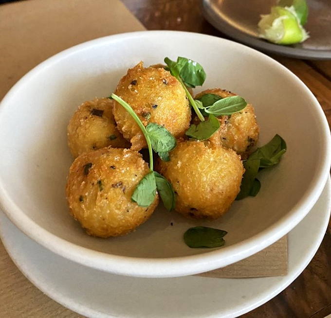 These black truffle cheese fritters don't just break diets—they make breaking up with carbs worth every magnificent, golden-fried moment of reconciliation.