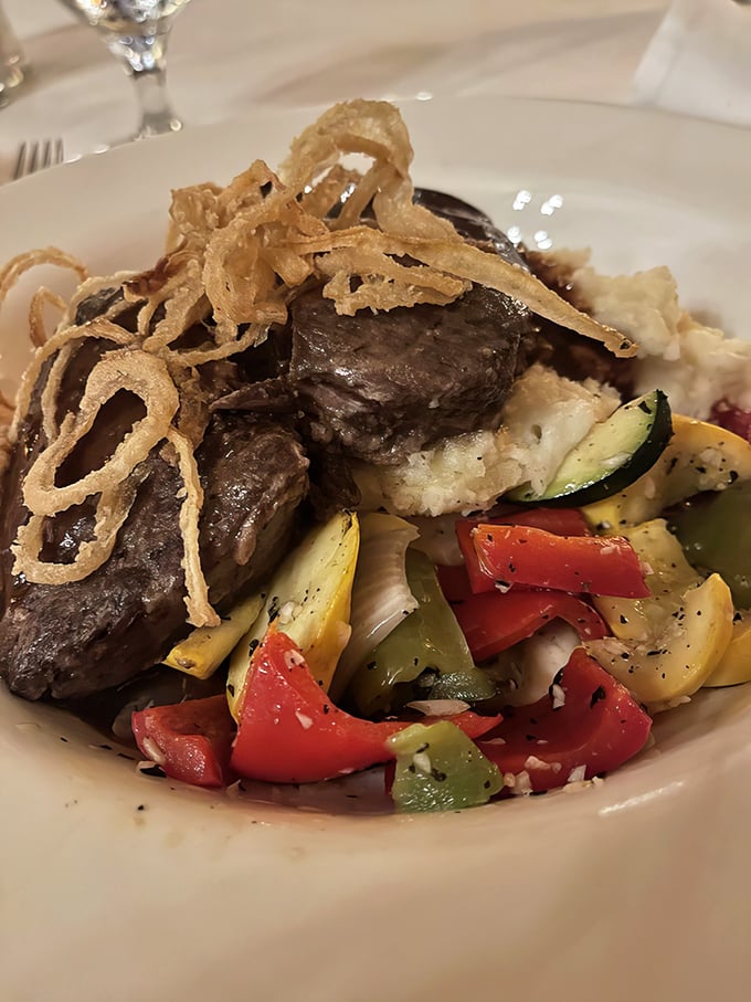 These braised short ribs don't just fall off the bone—they practically leap onto your fork, surrounded by a garden of colorful vegetables.