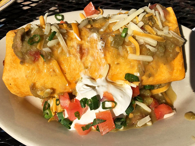 This breakfast burrito isn't just a meal, it's an event. Melted cheese cascades over perfectly seasoned fillings—fork and knife required!