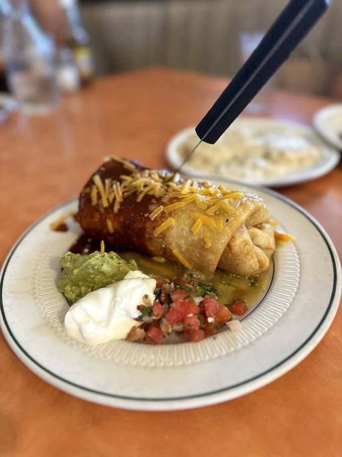 The Breakfast Chimichanga—where morning meets Mexico in a deep-fried embrace. Guacamole, sour cream, and pico de gallo complete this morning fiesta.