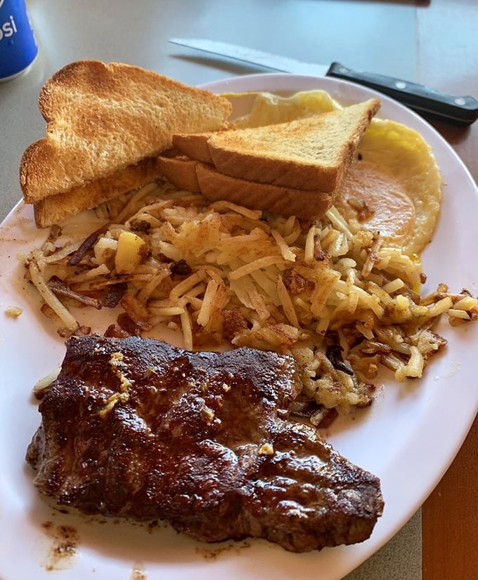 When a breakfast plate looks this good, you know you're in for a morning rodeo of flavors—steak, eggs, and hash browns done just right.