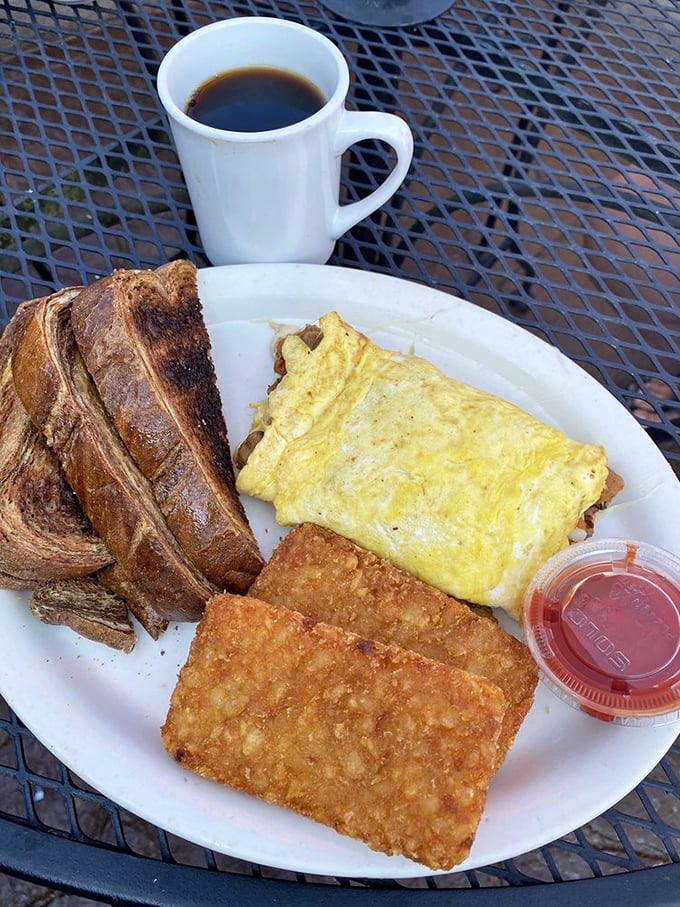 Breakfast nirvana: golden omelet, perfectly crisped hash browns, and toast the color of a summer tan. Coffee mandatory, diet optional.
