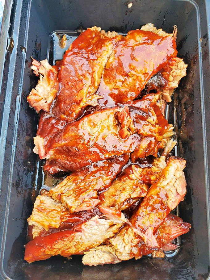 The brisket at Harry's doesn't need fancy plating—just a container sturdy enough to hold all that saucy, smoky goodness.
