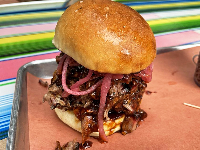 Not just a sandwich but a spiritual experience – chopped brisket crowned with pickled red onions on a pillowy bun.