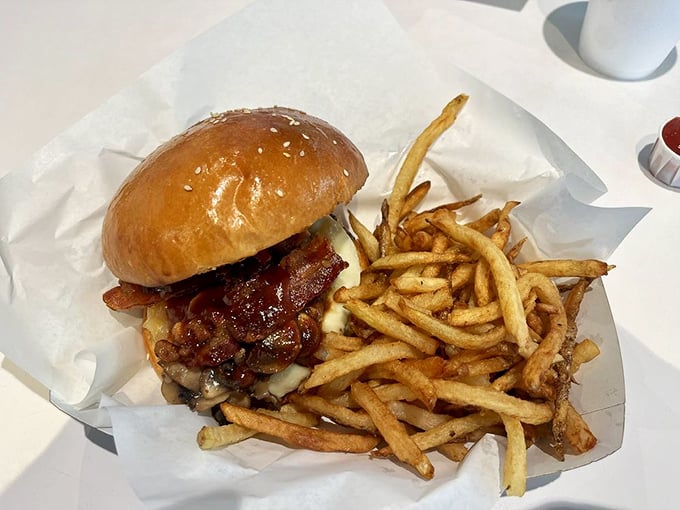 The Bronson Burger arrives like a flavor ambassador—bacon, melted cheese, and those golden fries that make you question all other potatoes.