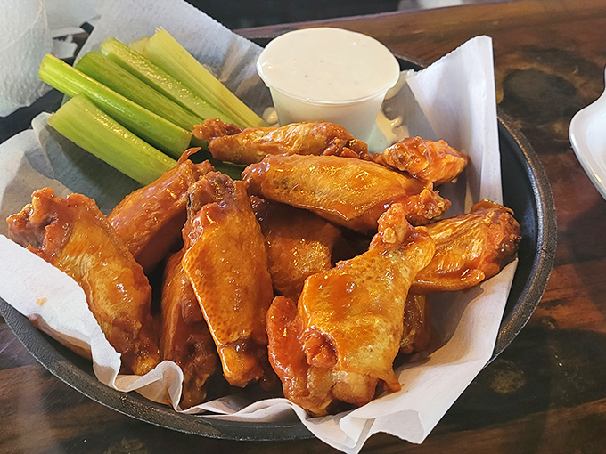 Buffalo wings that would make even a Buffalo native weep with joy. Crispy, saucy perfection served with the obligatory celery sticks—nature's edible napkins.