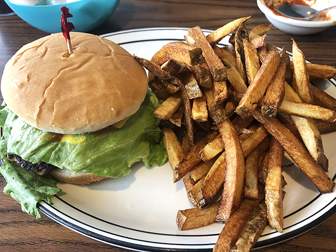 A burger that remembers when handmade meant something, sided with fries that actually taste like potatoes – imagine that!