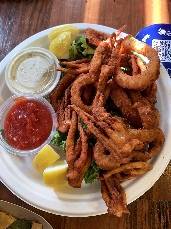 Calamari fries that achieve the impossible: perfectly crisp exterior giving way to tender squid within. The dipping sauces are merely supporting actors.