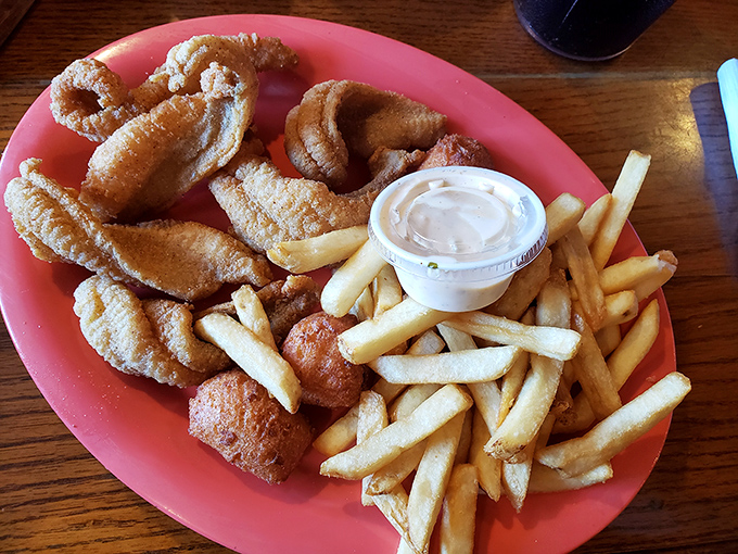 Golden, perfectly fried catfish with crisp french fries—sometimes the simplest pleasures are the most profound. This plate has converted many a seafood skeptic.