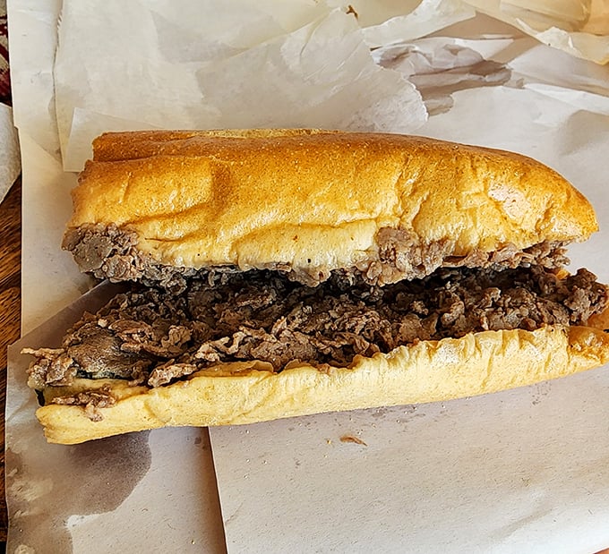 The star of the show – thinly sliced steak piled generously on a perfect roll. No fancy garnishes needed when the basics are executed this flawlessly.