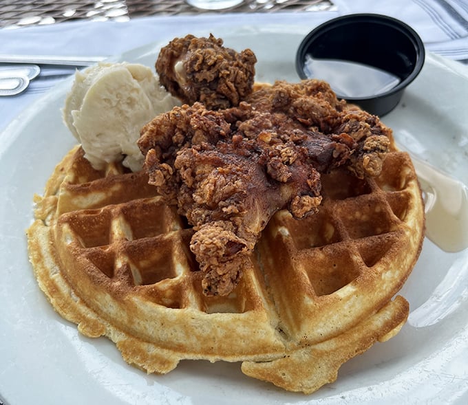 Southern comfort meets Pennsylvania hospitality—crispy fried chicken perched atop a golden waffle with a scoop of butter melting into every square.
