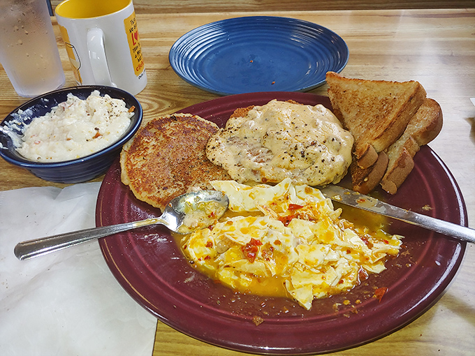 This colorful plate tells the whole story – vibrant eggs, perfectly seasoned potatoes, and a breakfast that doesn't need filters to look mouthwatering.