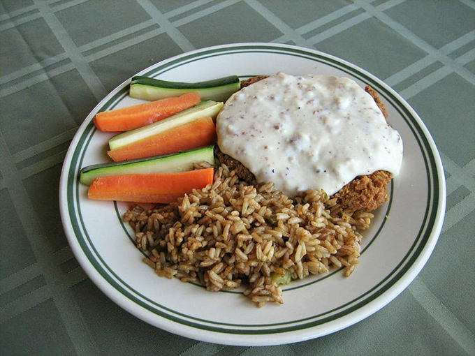 Golden-crusted chicken fried steak arrives like a warm hug from your favorite Southern grandmother's kitchen.