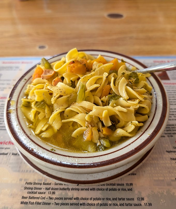The legendary chicken noodle soup—where thick, hearty noodles and chunks of chicken transform a simple bowl into a hug you can eat.