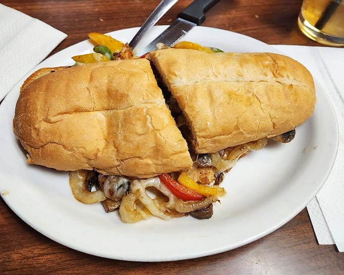 This Philly sandwich isn't just food, it's architecture – a masterpiece of melted cheese, grilled peppers and onions on a perfectly toasted roll.
