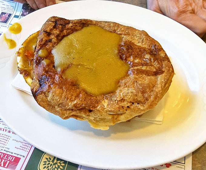 This apple pancake isn't just breakfast – it's a gravity-defying monument to morning indulgence, with warm cinnamon-apple filling that would make grandma jealous.