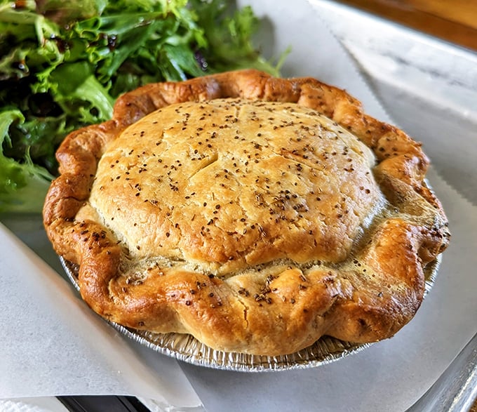 This isn't just chicken pot pie; it's comfort food architecture with flaky pastry walls protecting treasures within.