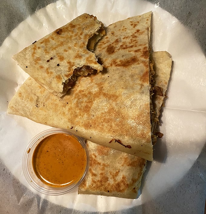 The quesadilla—that perfect marriage of crispy tortilla and molten cheese—functions as both comfort food and hangover prevention in one brilliant package.