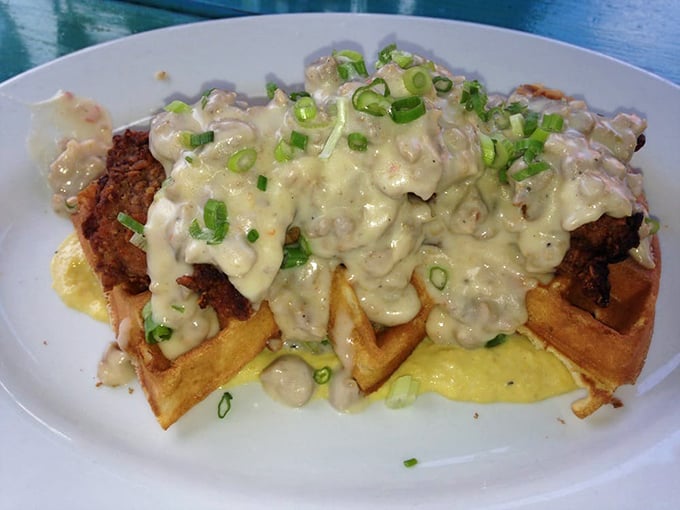 Chicken and waffles: where breakfast and dinner collide in a glorious pile of comfort food topped with scallions and creamy sauce.
