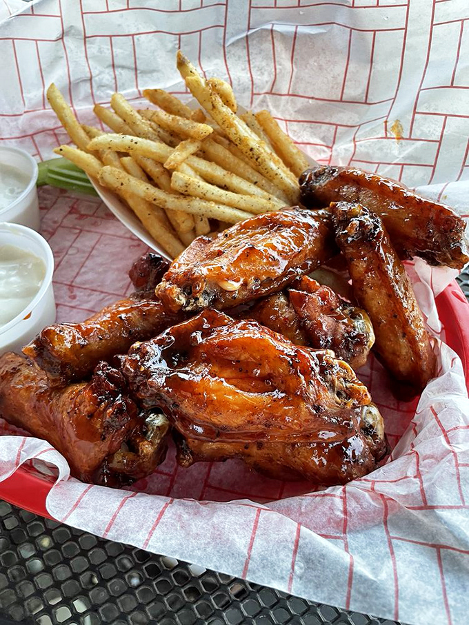 Wings that have clearly gone through a transformation more dramatic than any Hollywood makeover—smoked, sauced, and ready for their close-up.