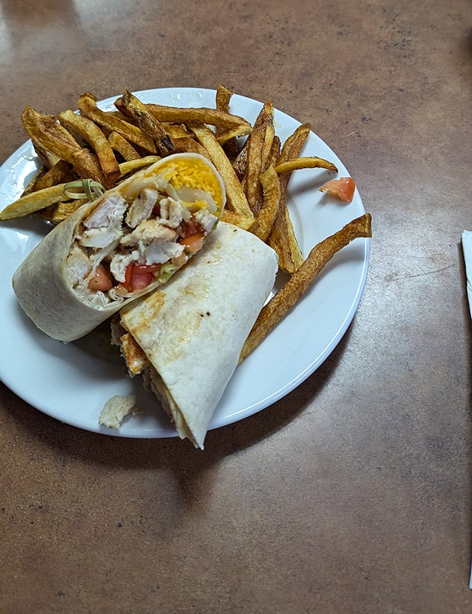 This chicken wrap isn't just playing dress-up—it's the real deal, with fresh ingredients bundled together like a delicious care package for your taste buds.