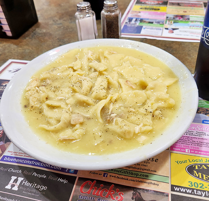 This chicken and dumpling soup isn't just a meal—it's a warm hug in a bowl, with dumplings floating like pillowy clouds in chicken heaven.