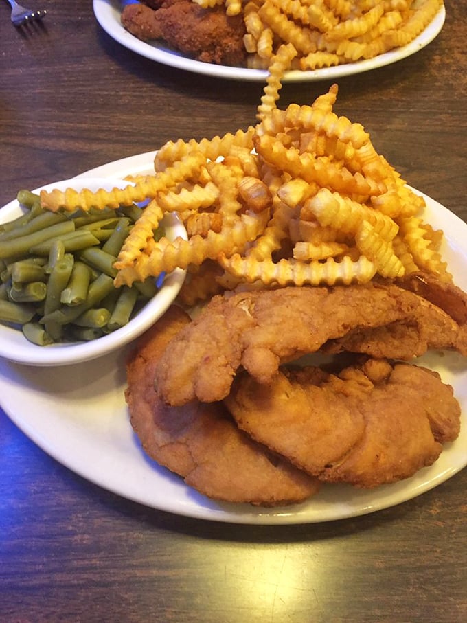 Golden-battered chicken strips that actually taste like chicken—imagine that! These crispy wonders and crinkle-cut fries could convert any fast-food loyalist.