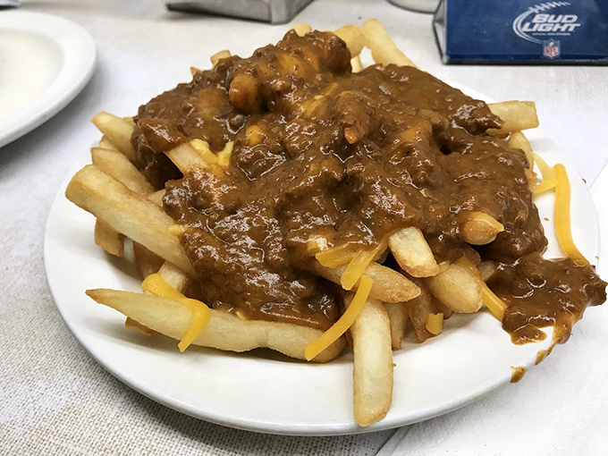 These chili cheese fries aren't trying to impress your Instagram followers—they're too busy preparing to impress your taste buds with their messy, glorious simplicity. 