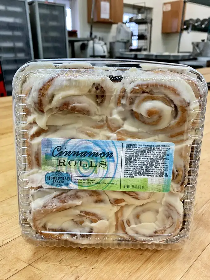 The stars of the show: Homestead's legendary cinnamon rolls, perfectly swirled and generously frosted. Four to a pack, zero chance they'll make it home.