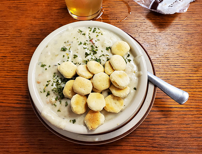 Clam chowder so hearty it could qualify as a main course. Those pillowy oyster crackers aren't just floating – they're performing synchronized swimming routines.