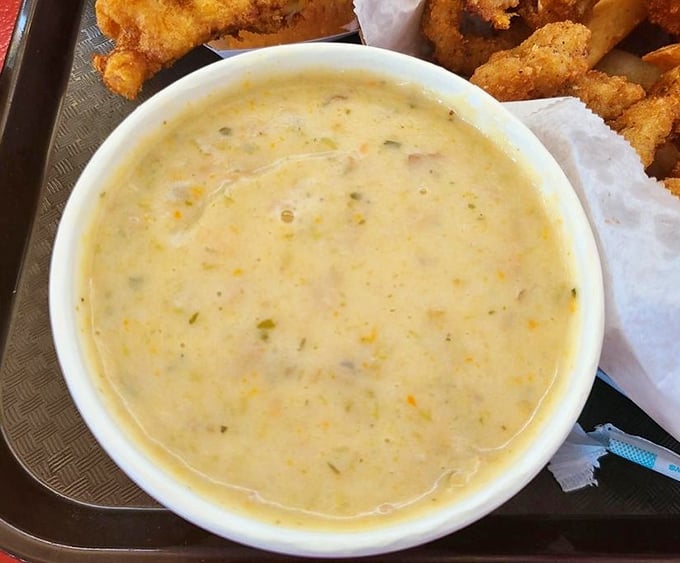 The legendary clam chowder in all its glory—creamy, chunky, and packed with more clams than your average beach at low tide.