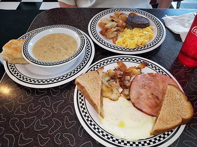 Breakfast perfection on a plate – sunny eggs, crispy home fries, ham, and toast ready to soak up golden yolk. Morning sunshine, regardless of weather.