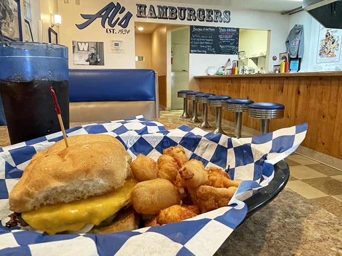 A classic cheeseburger nestled beside golden cheese curds—Wisconsin's dynamic duo that makes even the most sophisticated foodies weak at the knees.